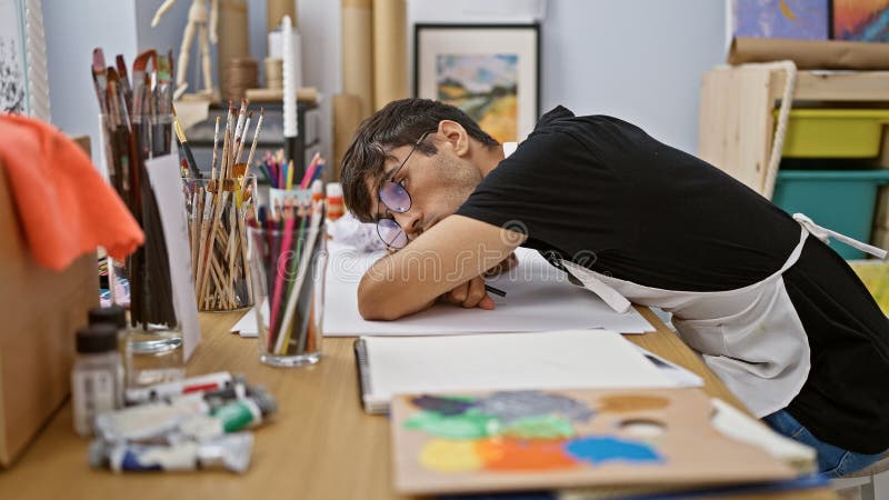 Exhausted Young Hispanic Man, an Art Student, Immersed in His Drawing ...