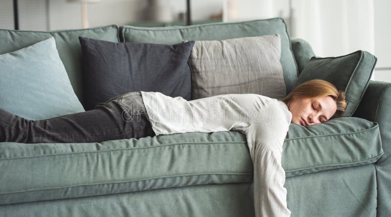 Exhausted Young Woman Resting at Home on Couch Stock Photo - Image of ...