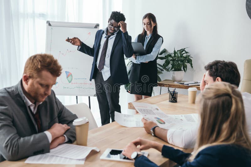 Exhausted Zombie Like Businesspeople Having Conversation Stock Image ... Exhausted Zombie Like Businesspeople Having Conversation Stock Image ...