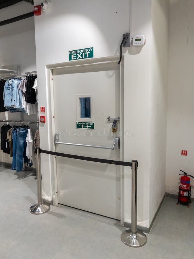 An Exit Door Indicating the Emergency Exit Sign Board and Alarm System ...