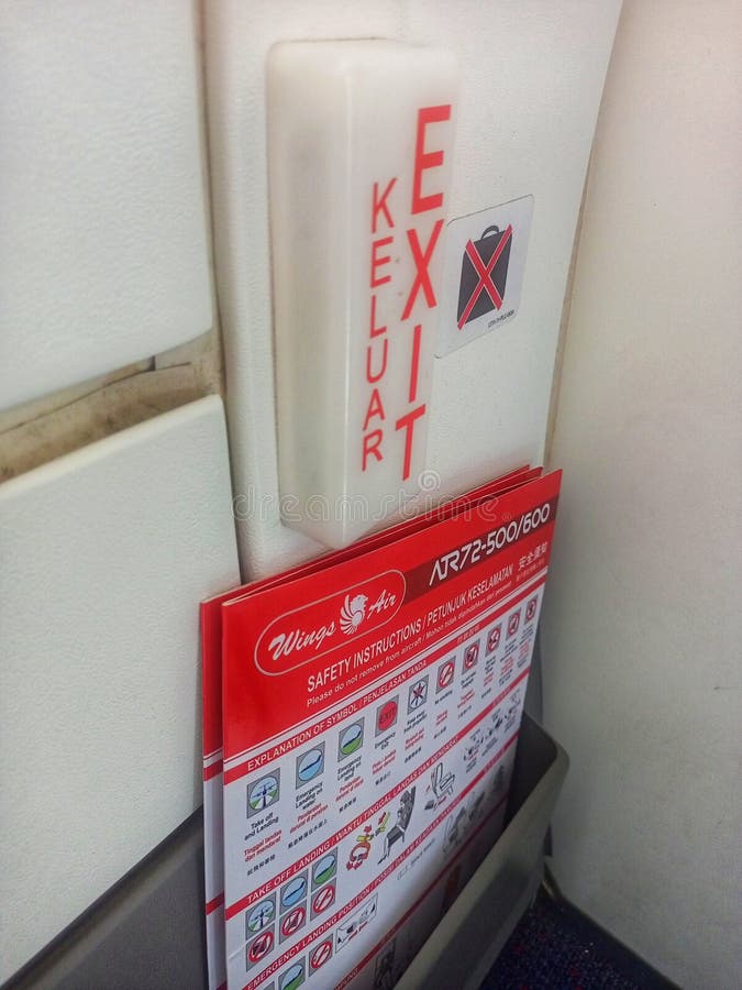 Exit door sign airplane editorial image. Image of text - 259643175