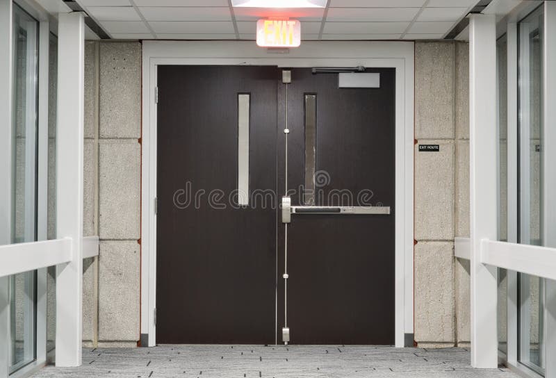 Exit Double Doors at the End of a Carpeted Office Corridor. Editorial ...