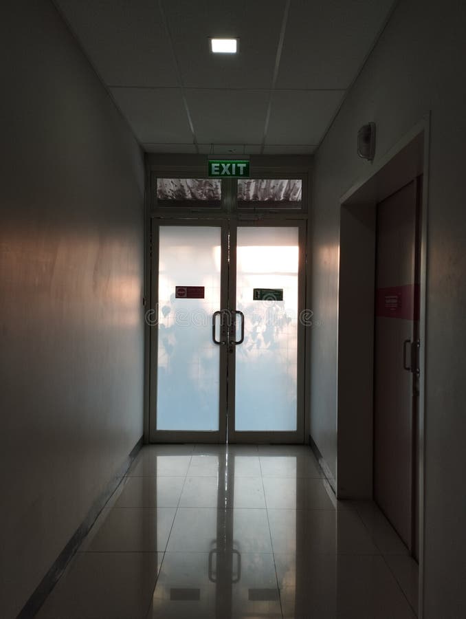 Exit Hallway with Sunlight Shining through the Glass Door in the ...