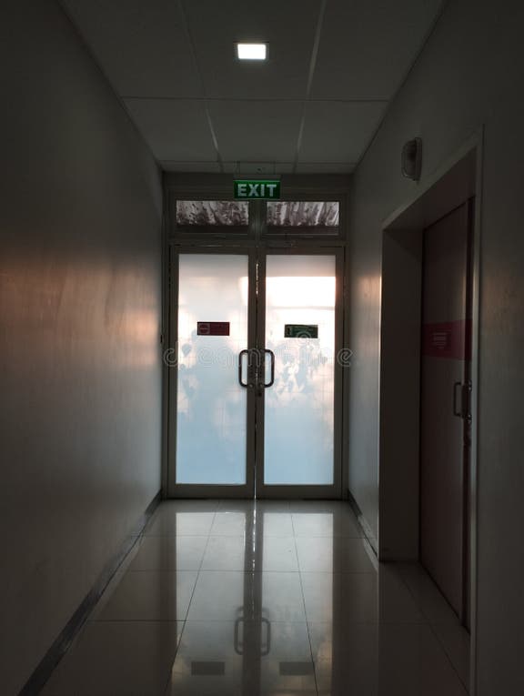Exit Hallway with Sunlight Shining through the Glass Door in the Afternoon Stock Image - Image ...