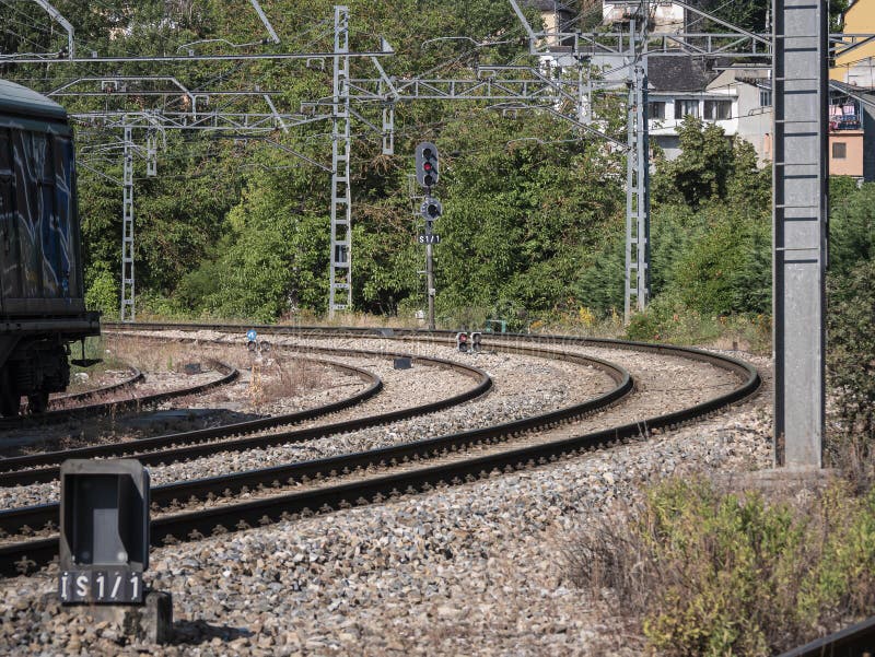 Red Exit Signs (stop) at a Station with the Tracks Situated in a Curve ...