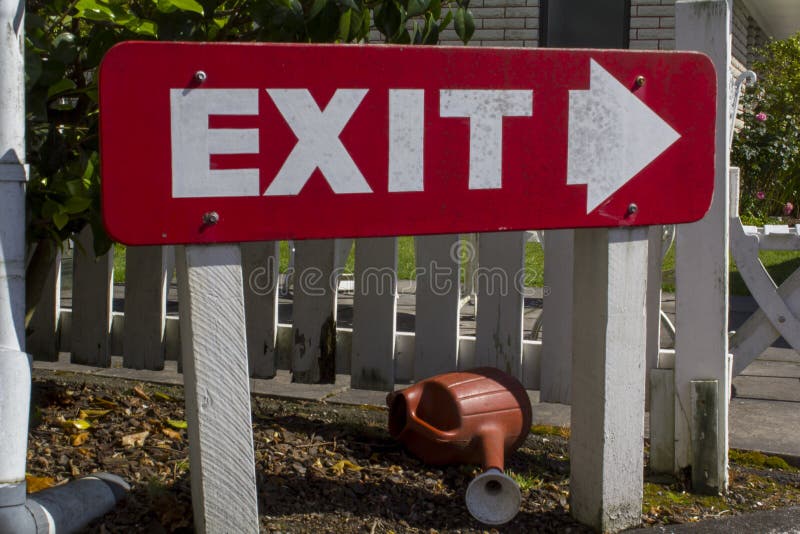 Exit Red Sign in garden stock image. Image of arrow - 110946117