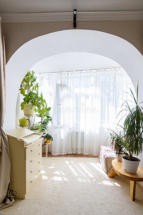 Exit from the Room in the Form of an Arch To a Spacious Glazed Balcony ...