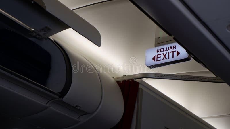 Exit sign in an aircraft. stock photo. Image of sign - 327168024