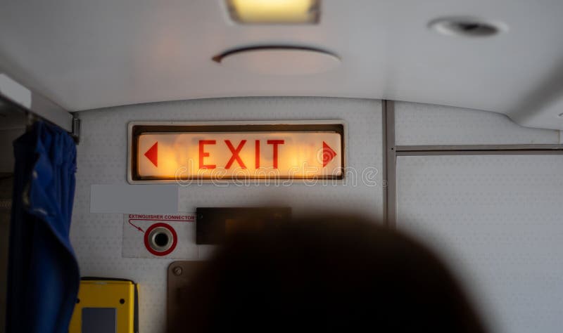 Exit Sign with Arrows Inside an Airplane Stock Photo - Image of plane ...