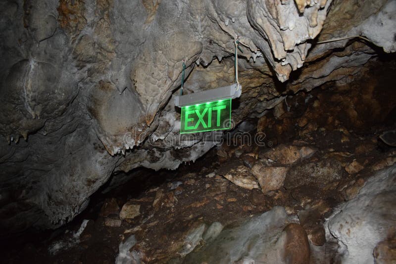 Exit sign in a cave. stock image. Image of cave, exit - 99972441
