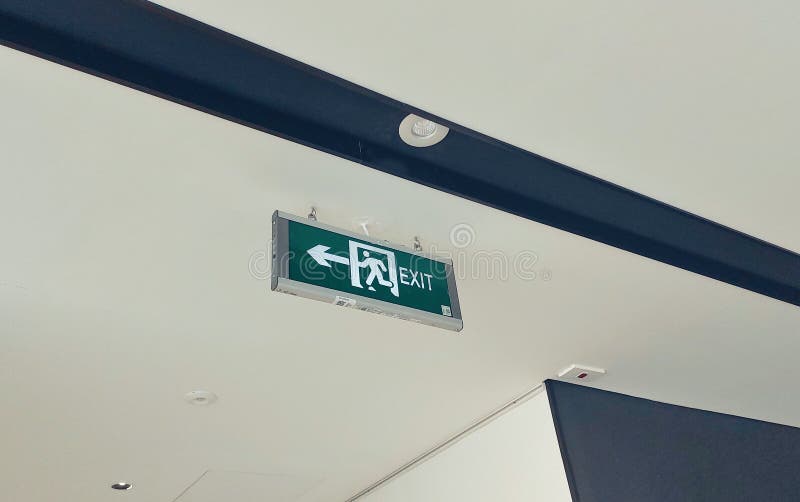 An Exit Sign in Green Color with White Ceiling Stock Image - Image of ...