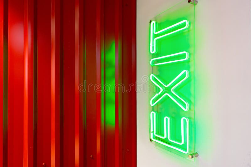 Exit Sign Green Light on the Wall Background Stock Photo - Image of ...