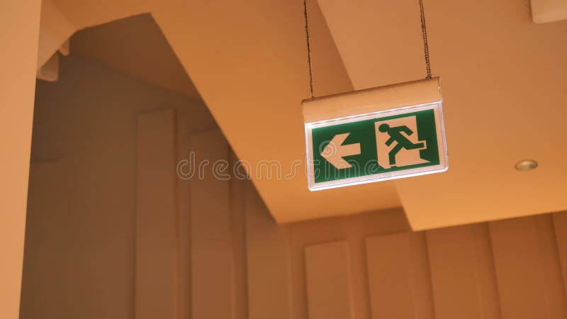 Exit Sign Guiding To Safety in a Building Stock Video - Video of left ...