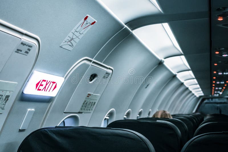 The Exit Sign Inside the Aircraft and Cabin Lights Stock Photo - Image ...