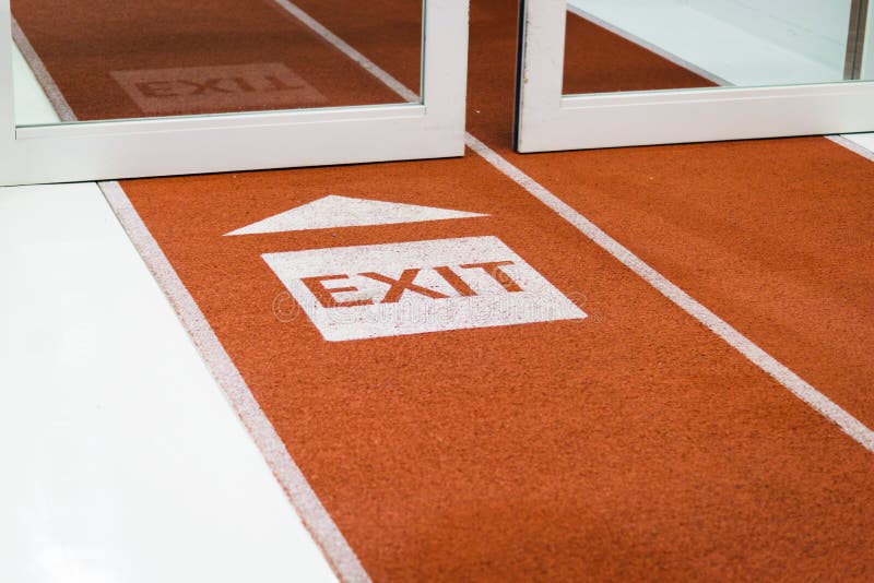 Exit Sign Painted on the Carpet - Airport Sign Stock Image - Image of ...