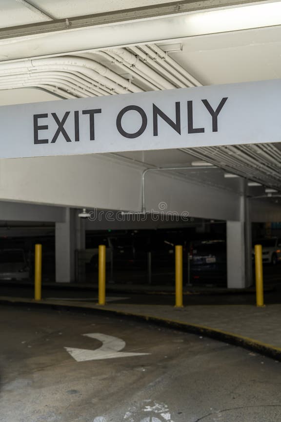 Exit only Sign in a Parking Garage Stock Image - Image of people ...