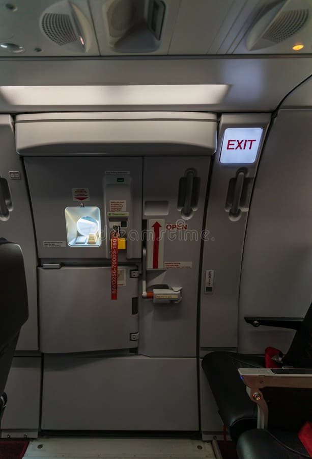 Exit Sign in Passenger Airplane. Emergency Exit Sign on Airplane Stock ...