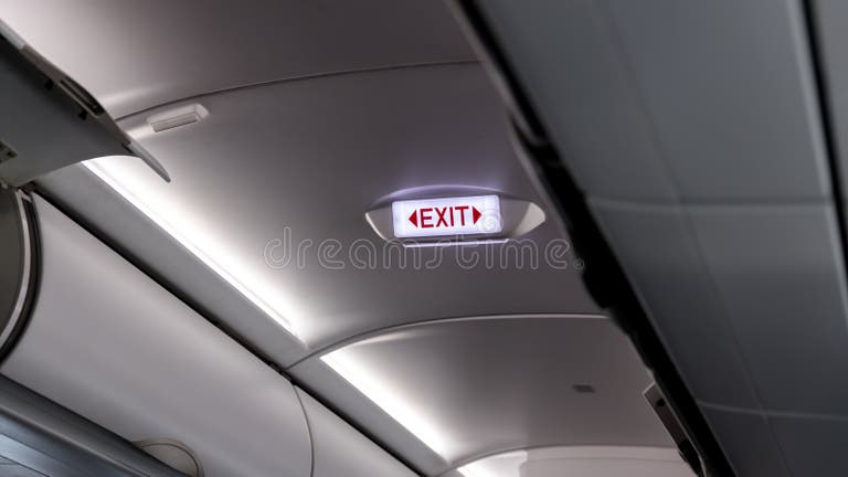Exit Sign in Passenger Airplane. Emergency Exit Sign on Airplane Stock ...