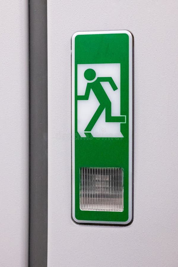 Exit Sign in a Passenger Plane. Emergency Exit Sign on the Wall Inside ...