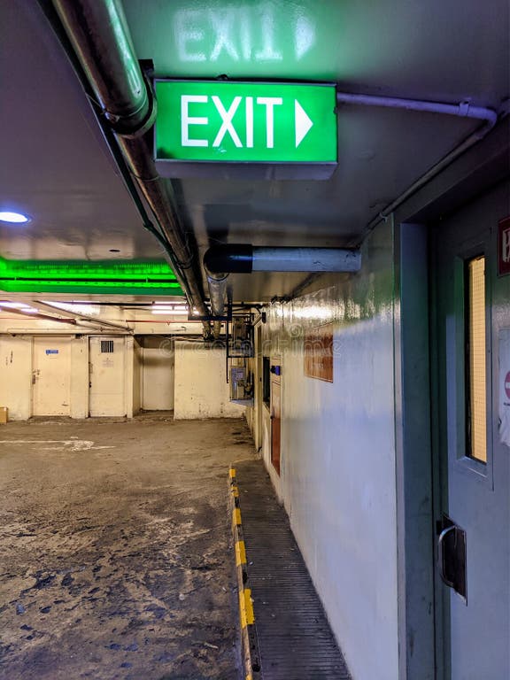 The Exit Sign in the Scary and Lonely Parking Lot Stock Photo - Image ...