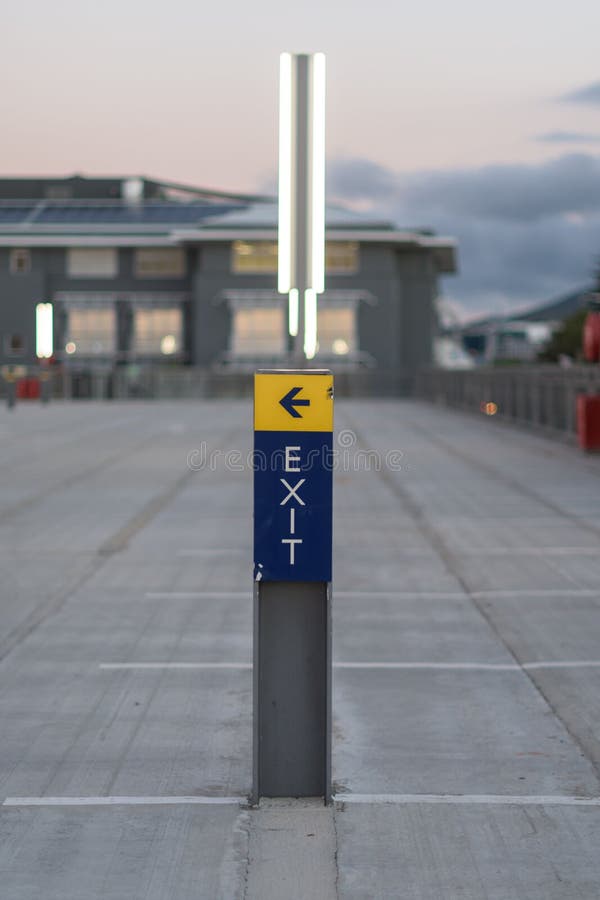 Exit Sign Showing the Way To Exit the Parking Place Stock Photo - Image ...