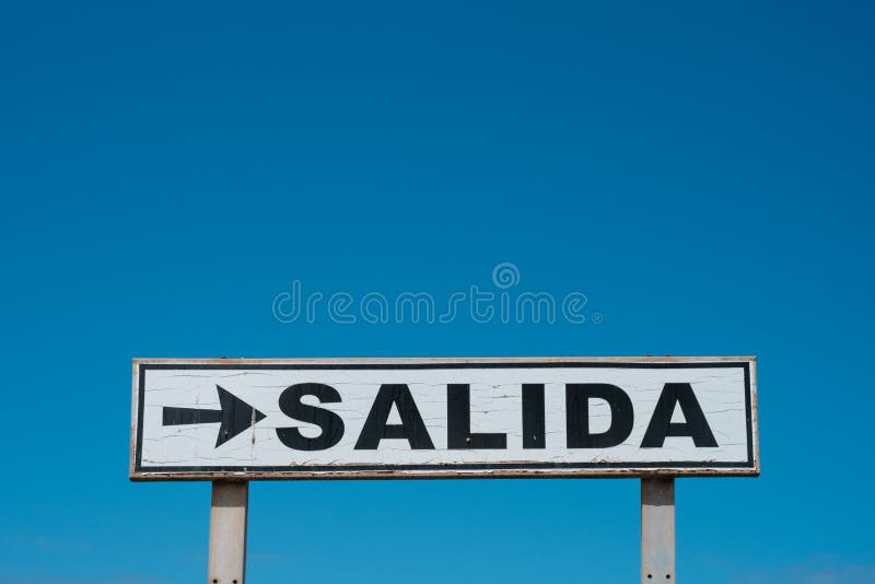 Exit Sign Spanish: SALIDA on Blue Sky - Stock Photo - Image of spanish ...