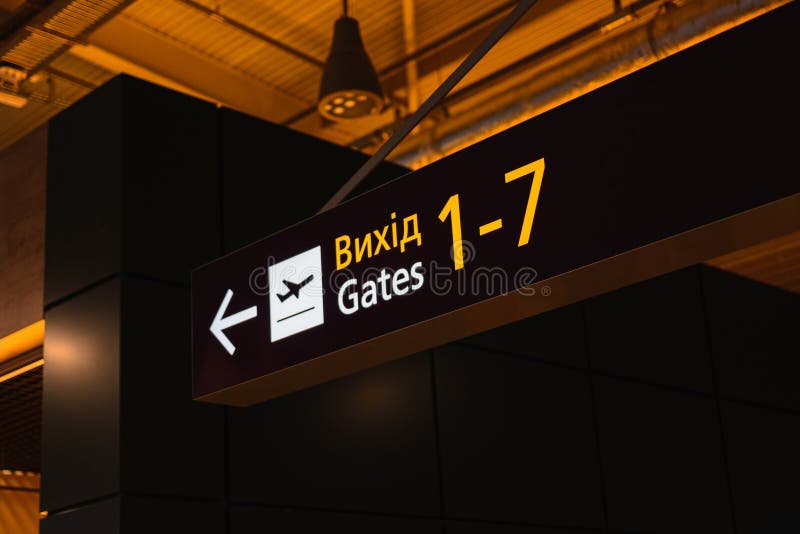 Exit Sign To the Gate on a Yellow Board at the Ukrainian Airport Stock ...