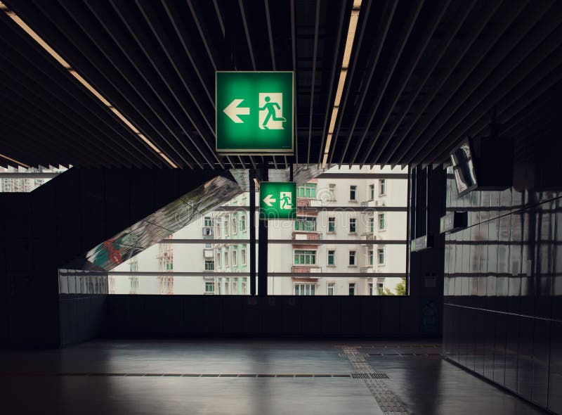 Exit Signs Illuminated with the Green Light in a Train Station ...