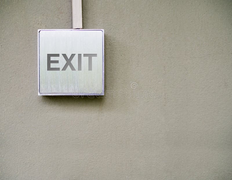 Exit on Silver Sign on Concrete Wall Stock Photo - Image of light ...