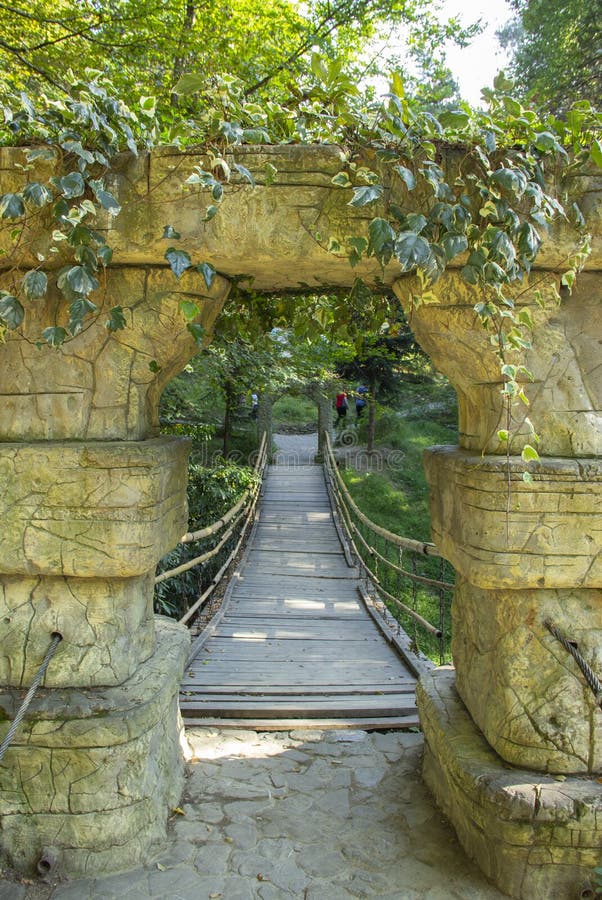 Exit To the Bridge Over the Arch. Hinged Bridge Over the River in the ...