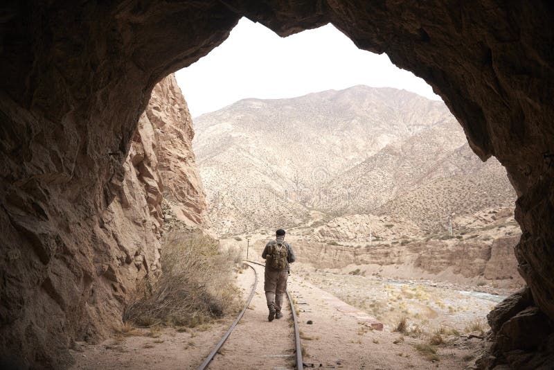 Exit of a Train Tunnel, Outside There is a Person Walking Along the ...