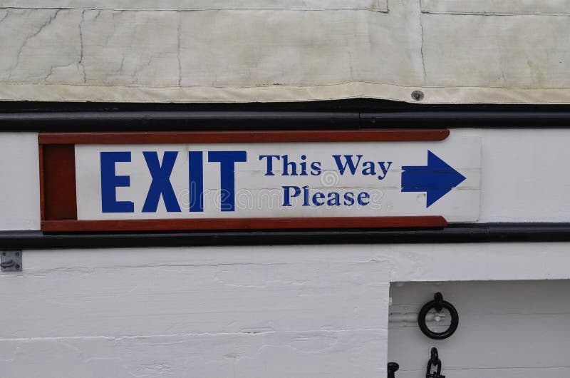 Exit this way please sign. stock image. Image of arrow - 49651793