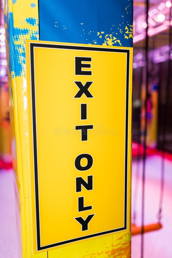 Exit only Yellow Sign in Indoor Amusement Center Stock Photo - Image of ...