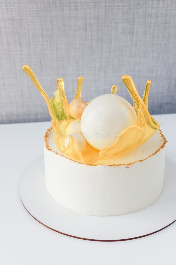 Exotic Cake with White Chocolate Spheres and Caramel Splash Decorated ...