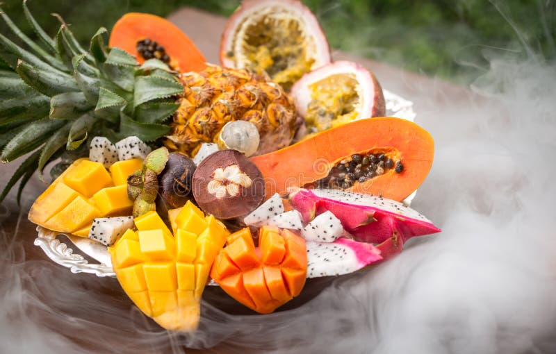 Exotic fruits in a smoke stock photo. Image of bowl - 105130108