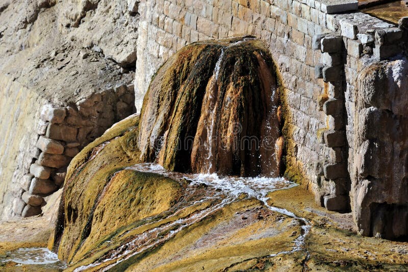 An Exotic-looking Stone Building Under a Rock. an Old Castle Covered in ...