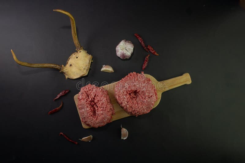 Exotic Meat in Background and Deer Antlers Stock Image - Image of ...