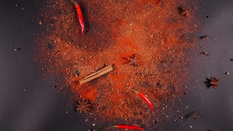 Exotic Spices and Chilli Pepper Flying Up and Falling Down in Slow ...