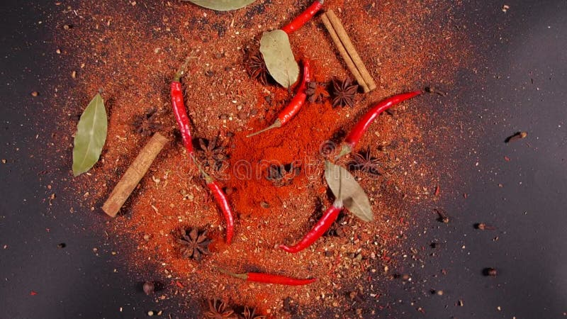 Exotic Spices and Chilli Pepper Flying Up and Falling Down in Slow ...