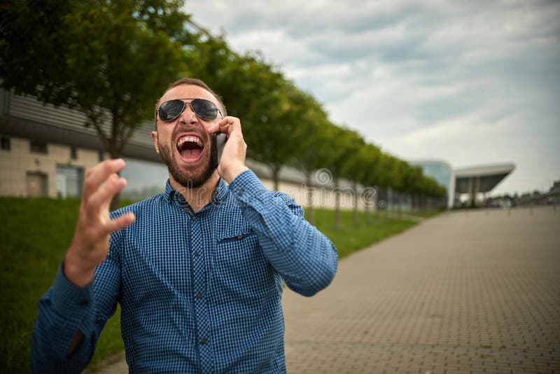 Expanding His Empire Using Technological Resources. Man is Talking on ...