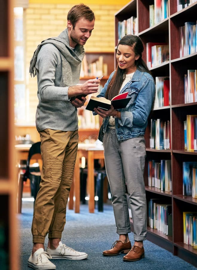 Expanding on Their Knowledge Together. Two University Students Working ...