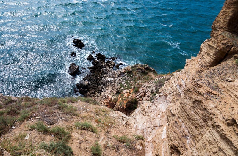 Expansive Cliff Face Overlooking the Breathtaking Ocean, with Waves ...