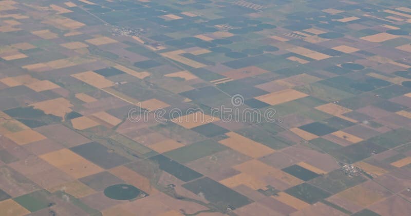 Aerial View of Patchwork Farmland with Diverse Crops during a Clear Day ...