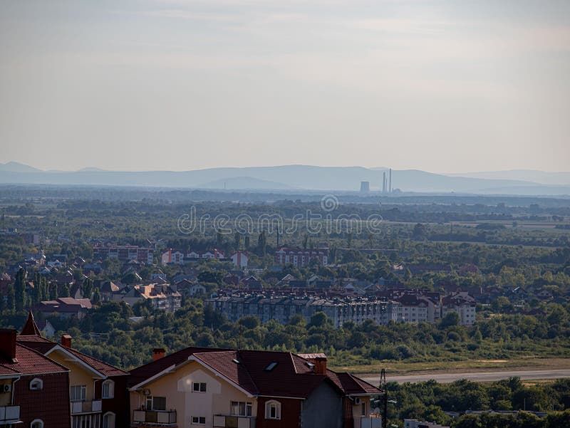 An Expansive, Flat Terrain, Dotted with Various Structures and ...