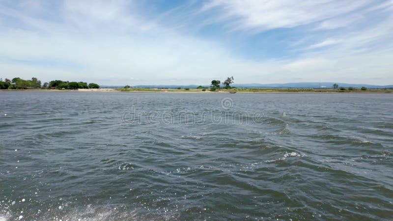 Expansive Lake View with Rippling Waters Under Wispy Clouds Stock ...