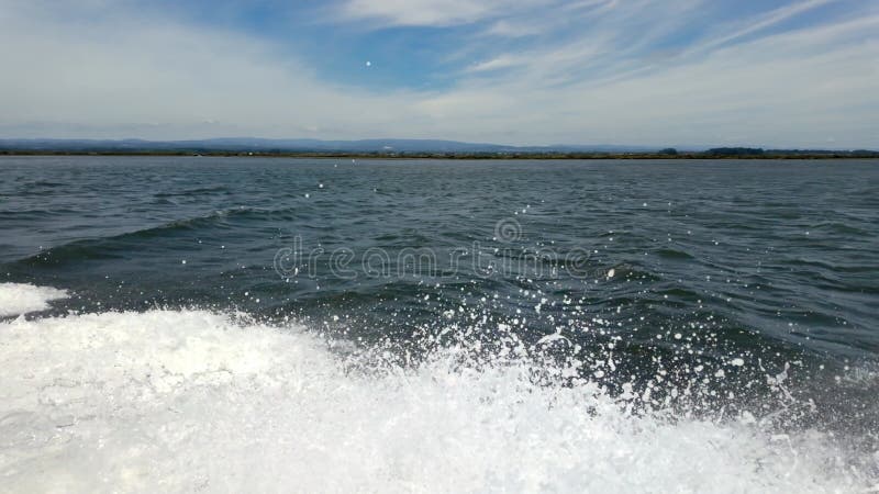Expansive Lake View with Rippling Waters Under Wispy Clouds Stock Video ...
