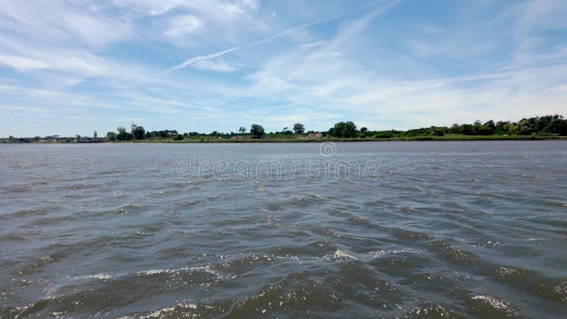Expansive Lake View with Rippling Waters Under Wispy Clouds Stock Video ...