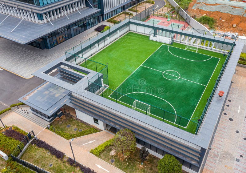 Expansive Soccer Field Situated in Front of a Large Building. Stock ...