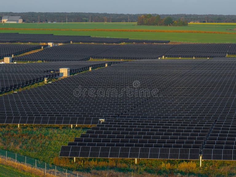 Expansive Solar Panel Farm in Lithuania with Lush Green Fields Stock ...