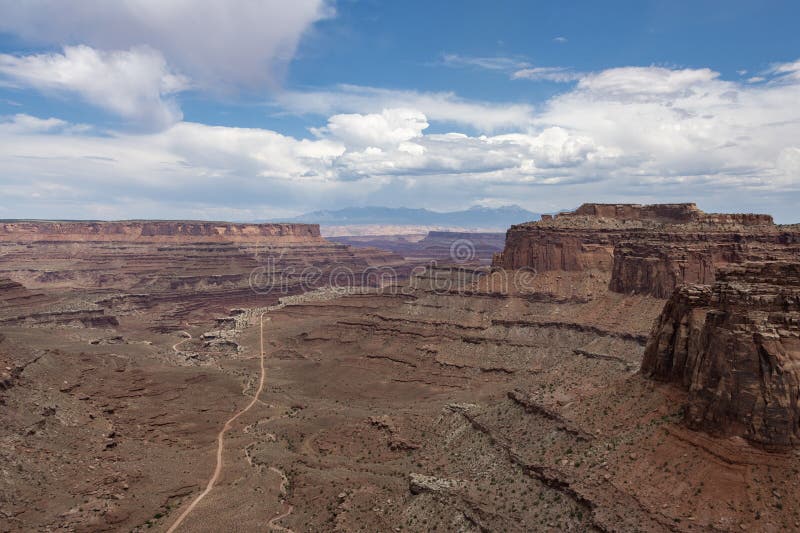 Expansive View of Desert Landscape with Dramatic Rock Formations in a ...